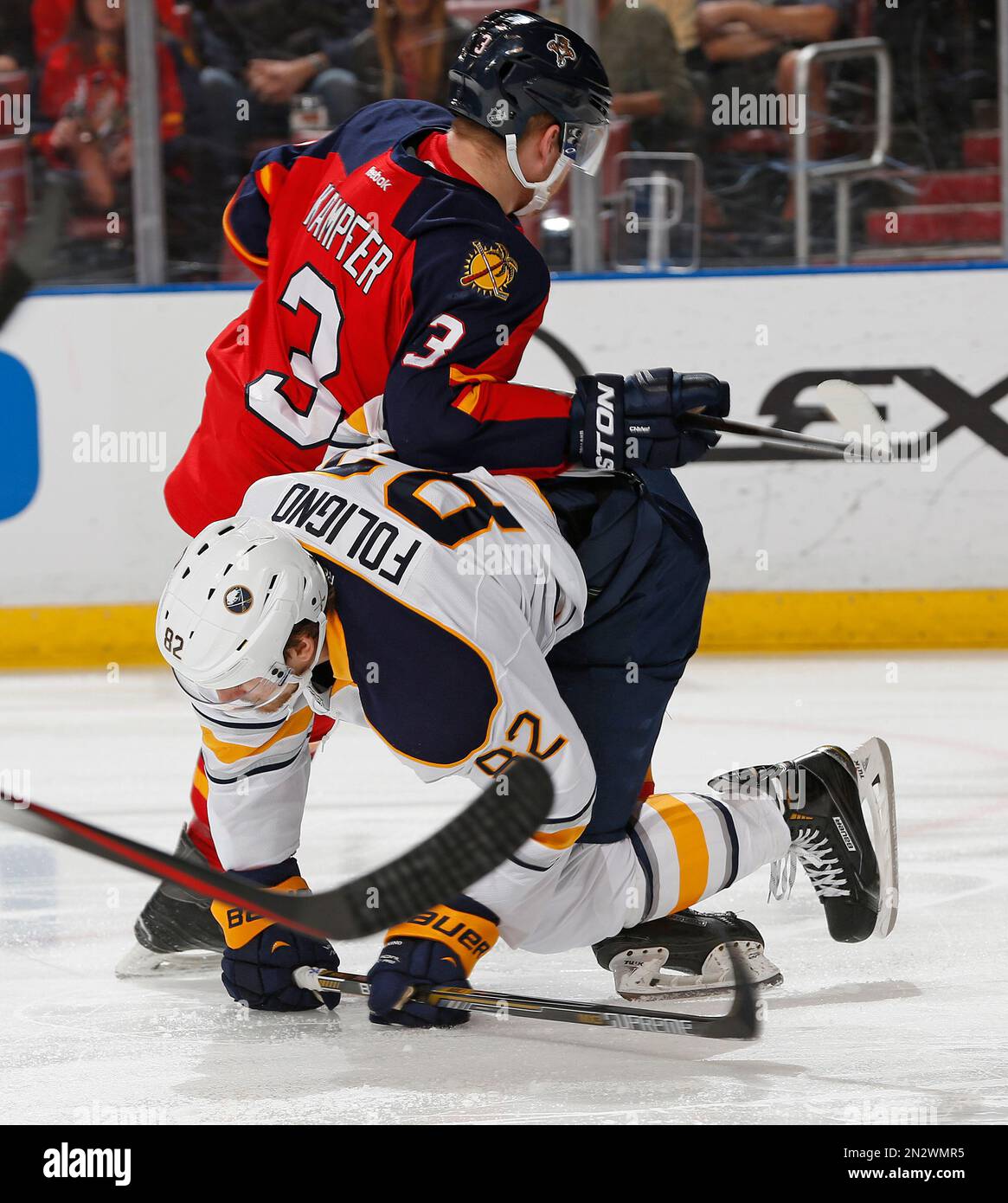 Buffalo Sabres forward Marcus Foligno (82) is taken to the ice by ...