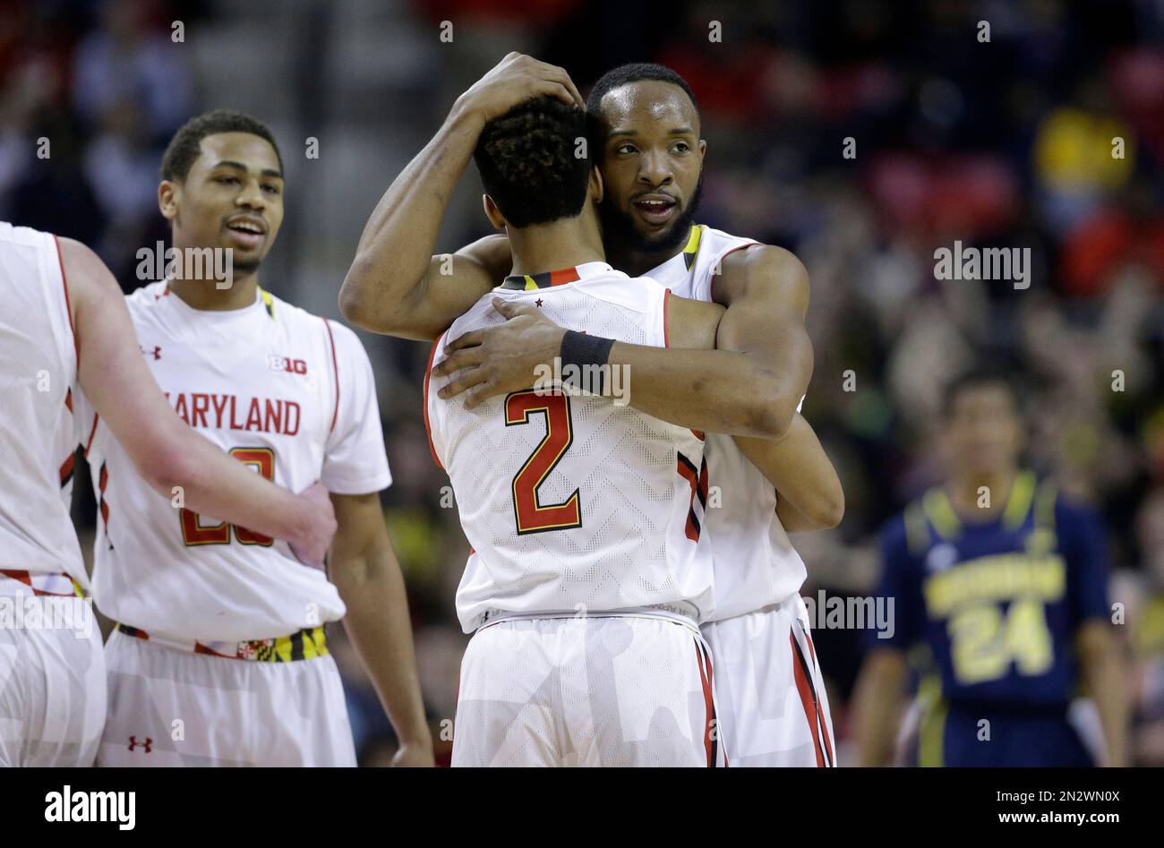 Maryland guard/forward Dez Wells, right, hugs teammate Melo Trimble in ...