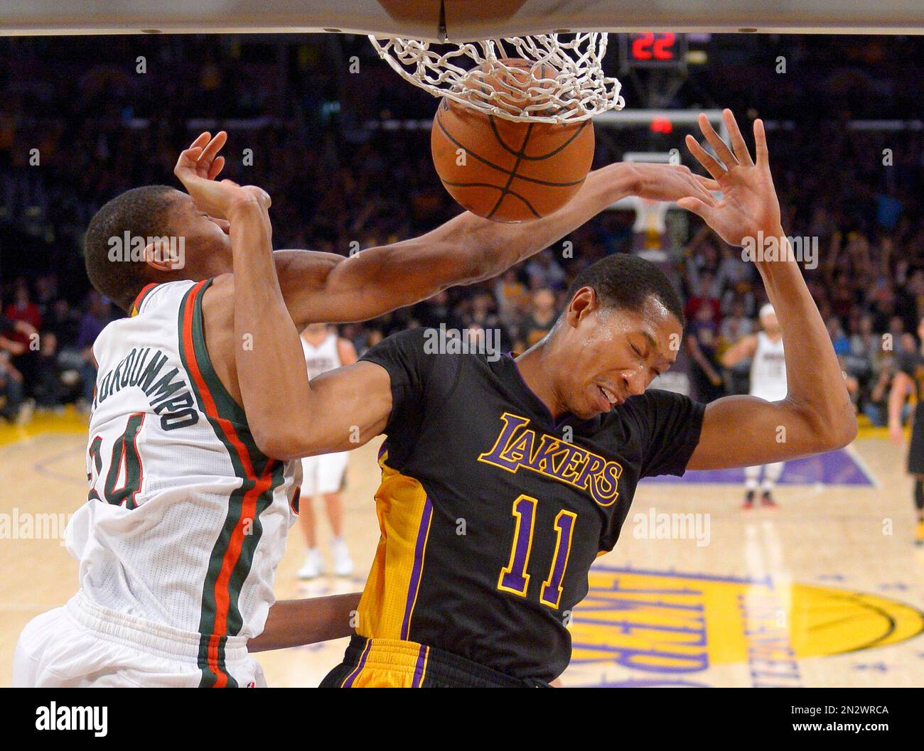 Los Angeles Lakers forward Wesley Johnson, right, dunks as Milwaukee ...
