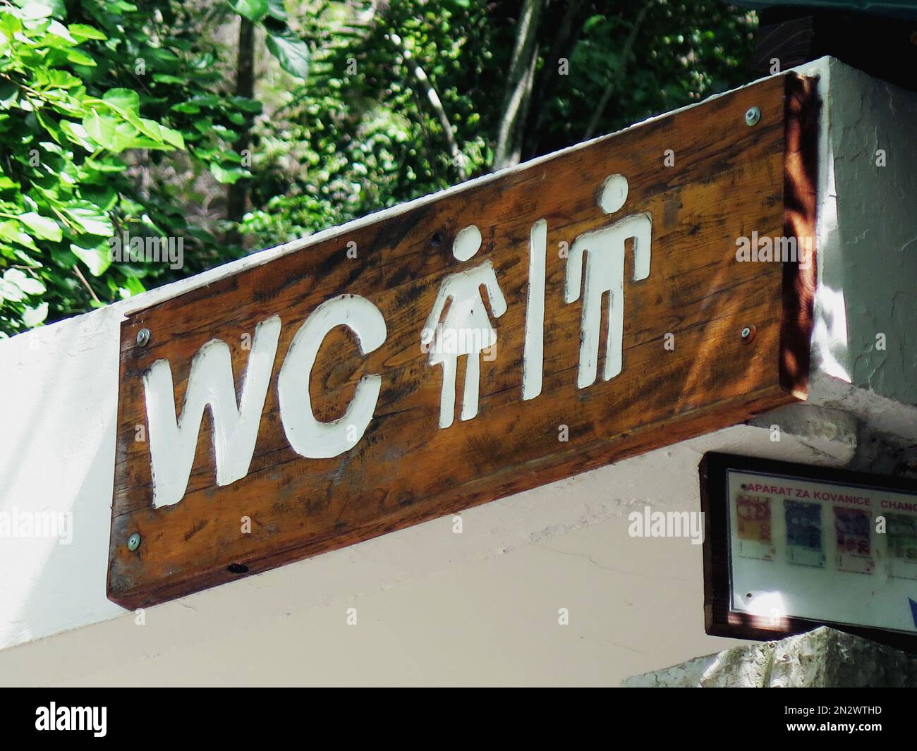 wooden wc toilet sign with white letters Stock Photo - Alamy
