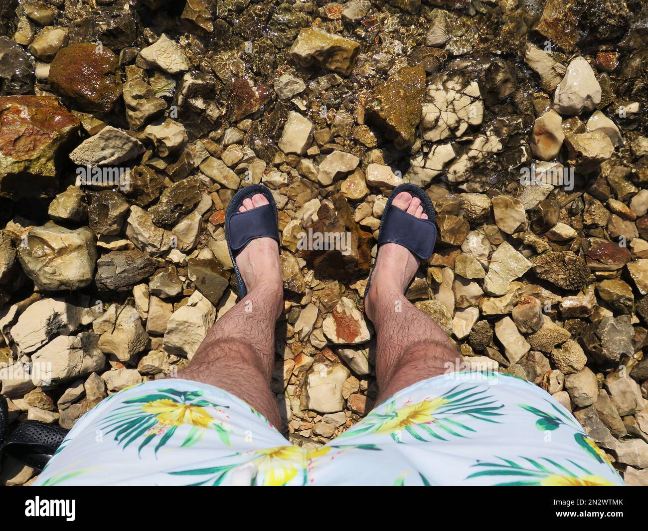 Funny vacation summer photo of feet in blue flip flops and colorful ...