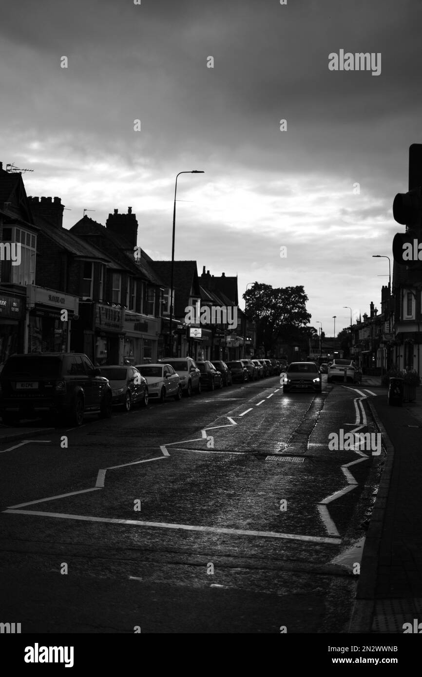 A vertical grayscale shot of a typical moody street scene Stock Photo ...