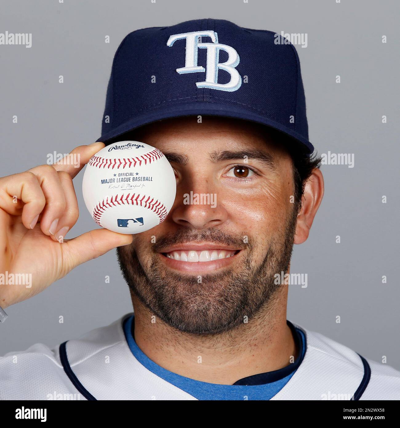 Tampa Bay Rays outfielder David DeJesus poses with a baseball covering ...