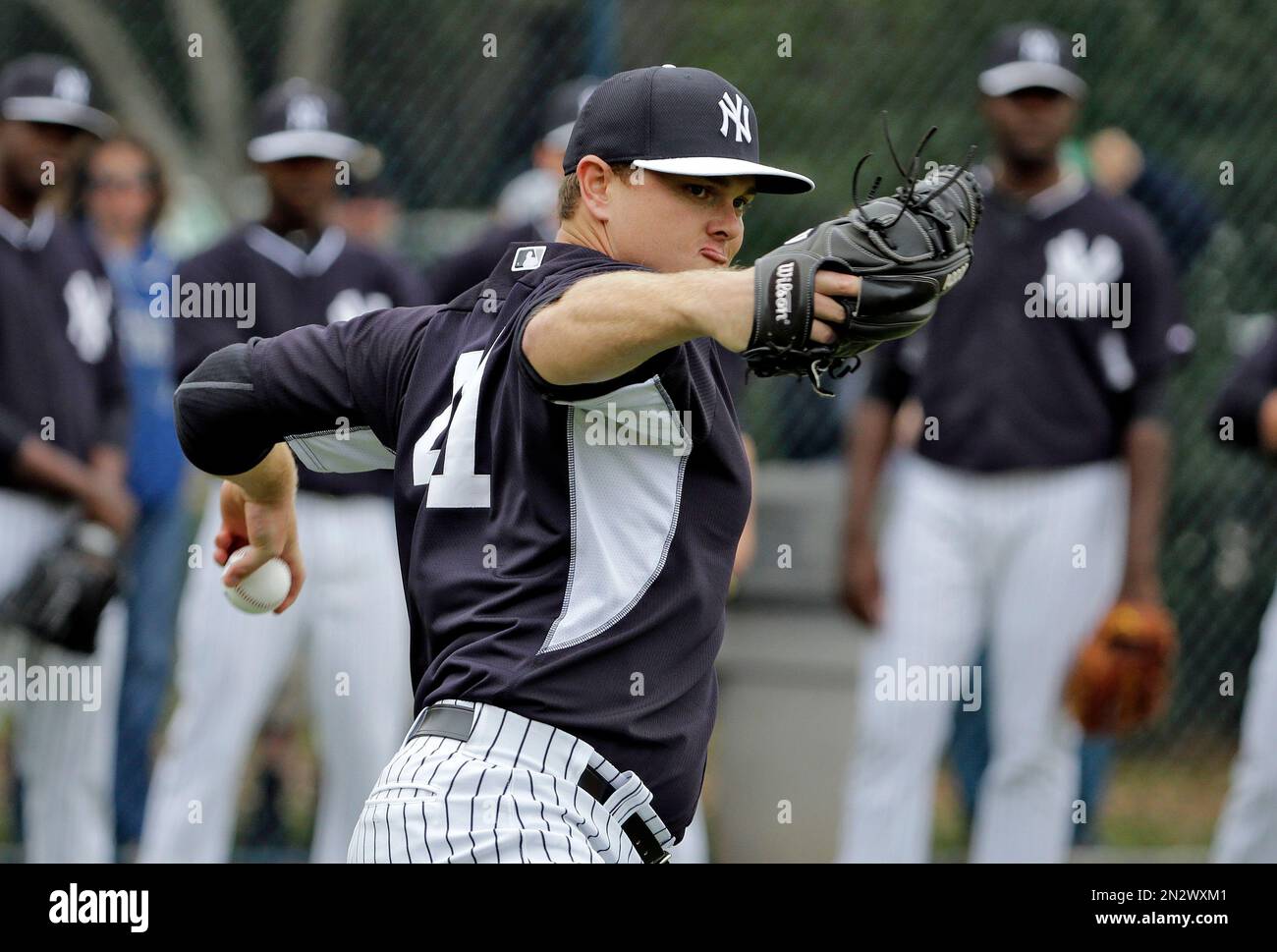 New York Yankees pitcher Justin Wilson throws the ball to first base ...