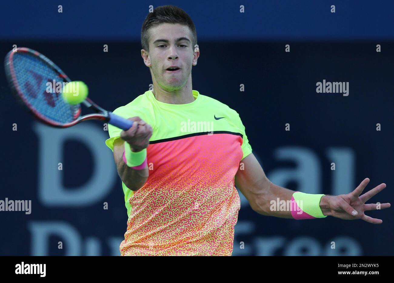 Borna Coric of Croatia returns the ball to Roger Federer of Switzerland ...