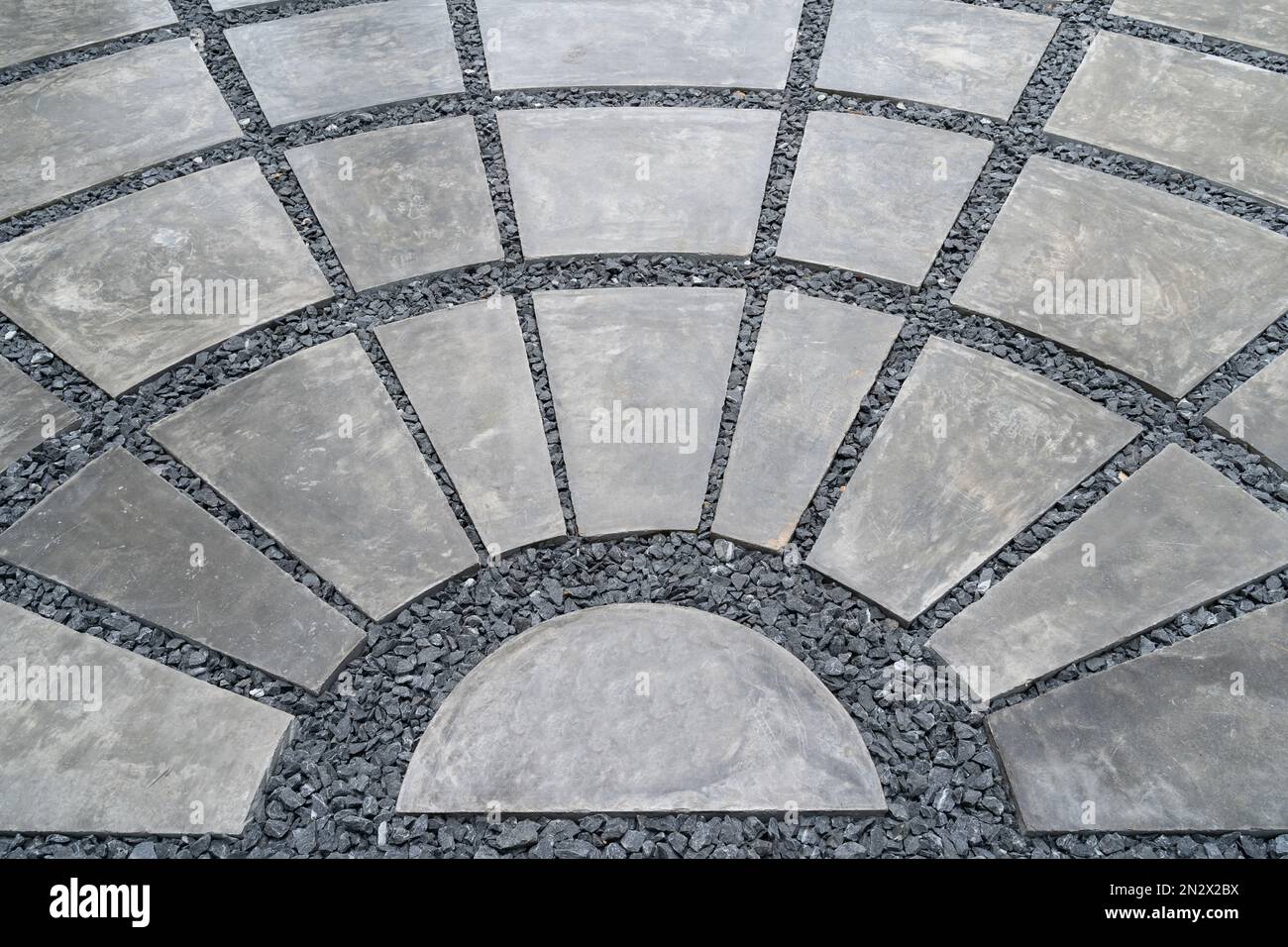 Cobblestone arched pavement road with stone Stock Photo - Alamy