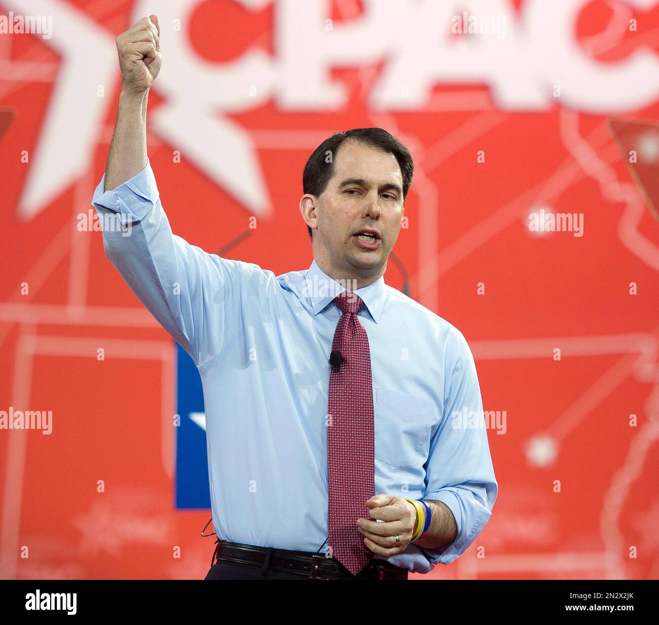 Wisconsin Gov. Scott Walker waves while speaking during the Conservative Political Action ...
