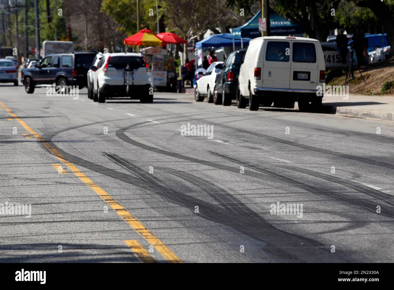 Car skid marks are visible along a street in the Chatsworth section of ...