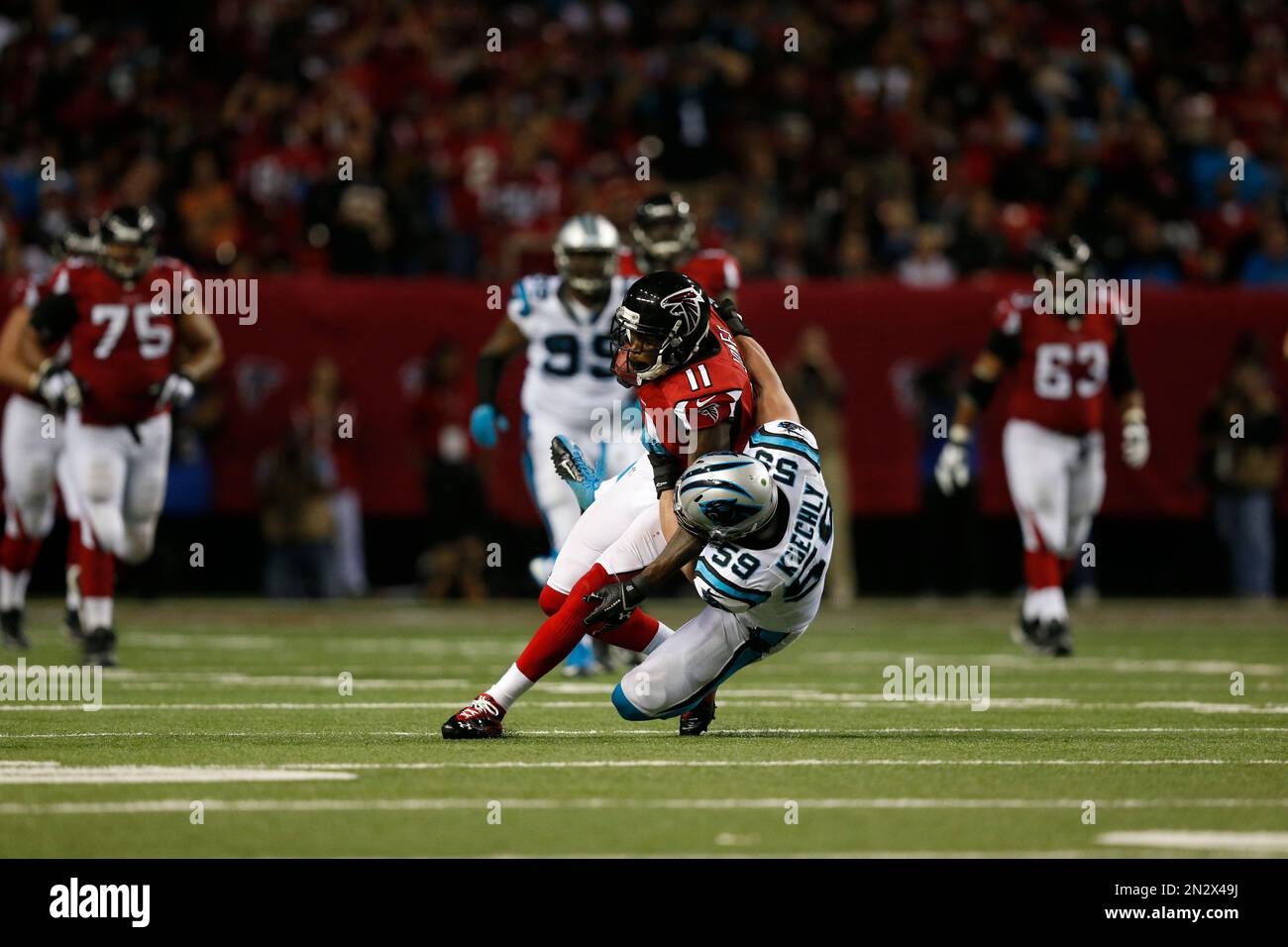 Atlanta Falcons wide receiver Julio Jones (11) is hit by Carolina ...
