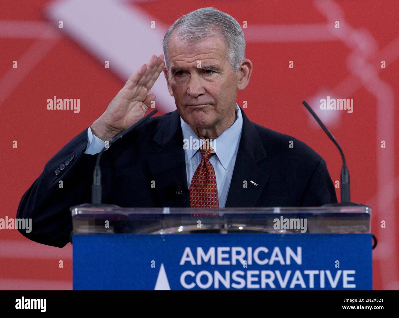 Retired Marine Lt. Col. Oliver North salutes after speaking during the ...