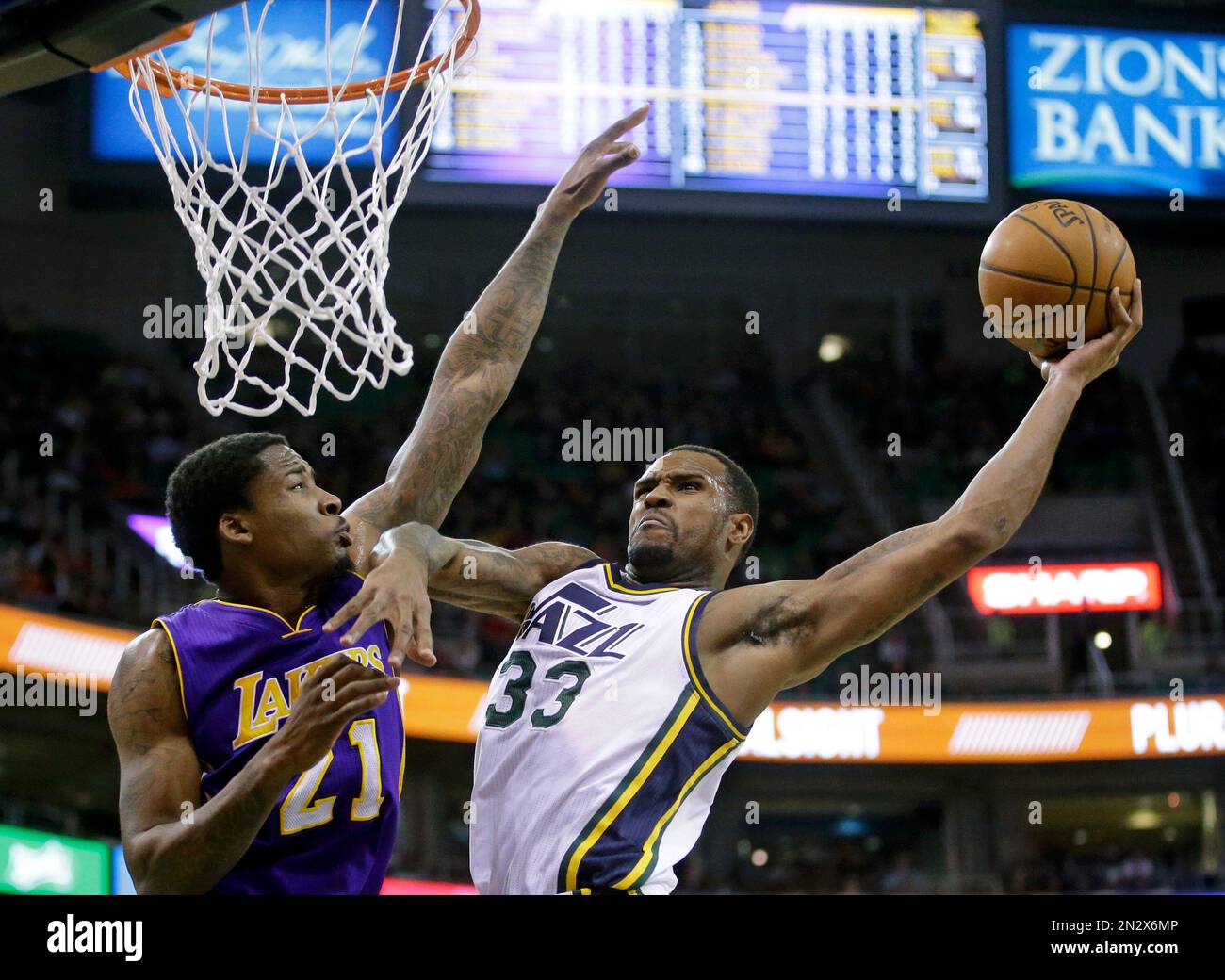 Utah Jazz forward Trevor Booker (33) goes to the basket as Los Angeles ...