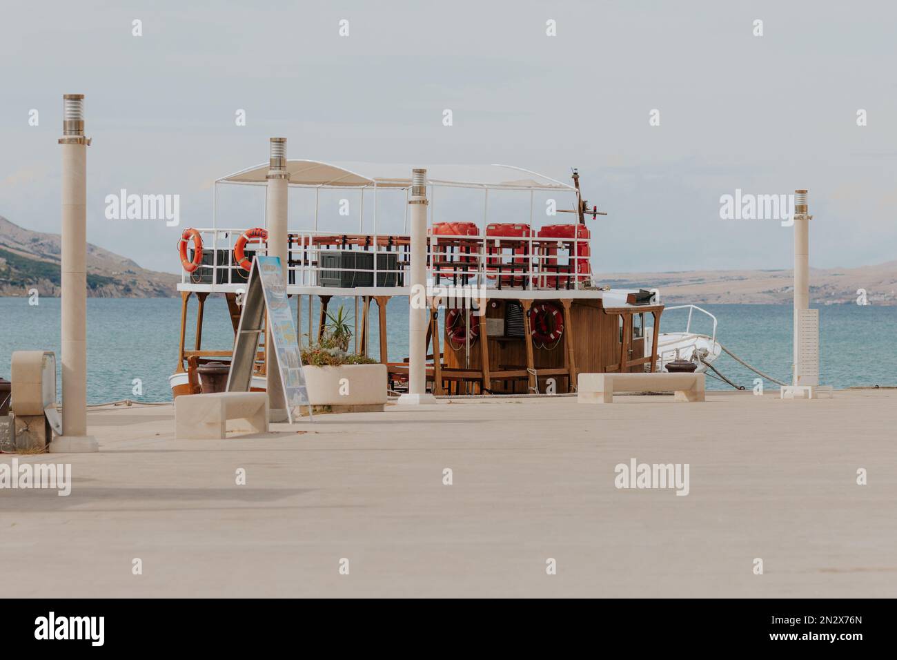 Travelling on the beautiful coastline with a boat Stock Photo - Alamy