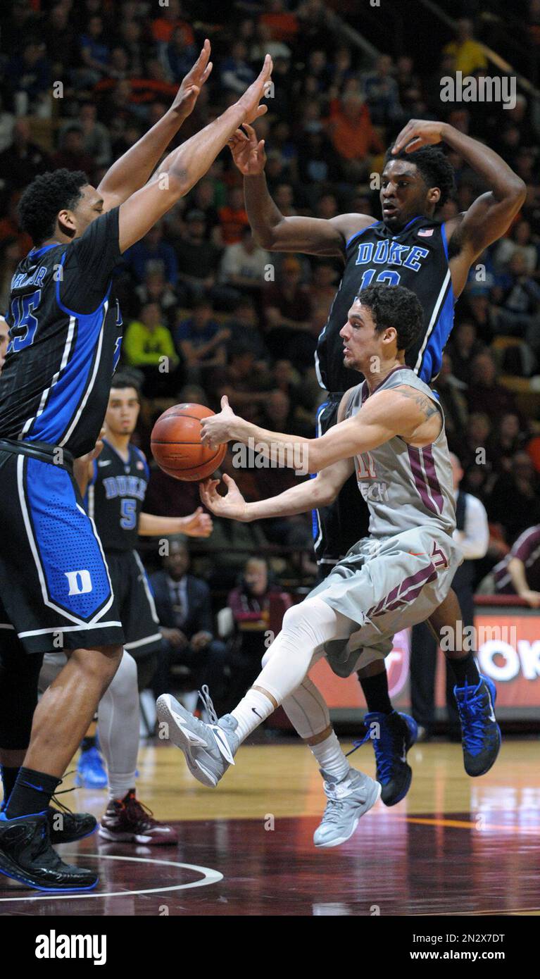 Virginia Tech's Devin Wilson passes off the ball between Duke's Jahlil Okafor and Justise ...