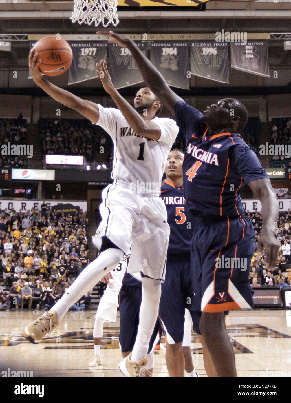 Wake Forest's Madison Jones (1) shoots in front of Virginia's Marial ...