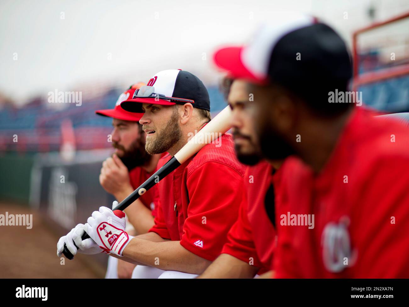 Washington Nationals' Bryce Harper, second from left, waits to take ...