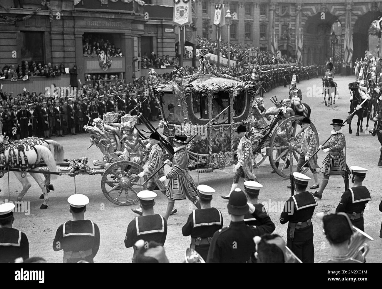 Britain's King George VI, wearing his Cap of State, and Queen Elizabeth ...