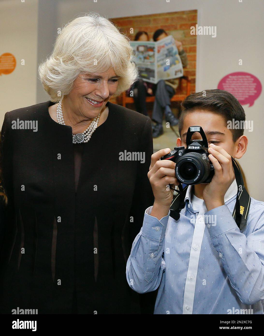Britain's Camilla, The Duchess of Cornwall, watches young photographer ...