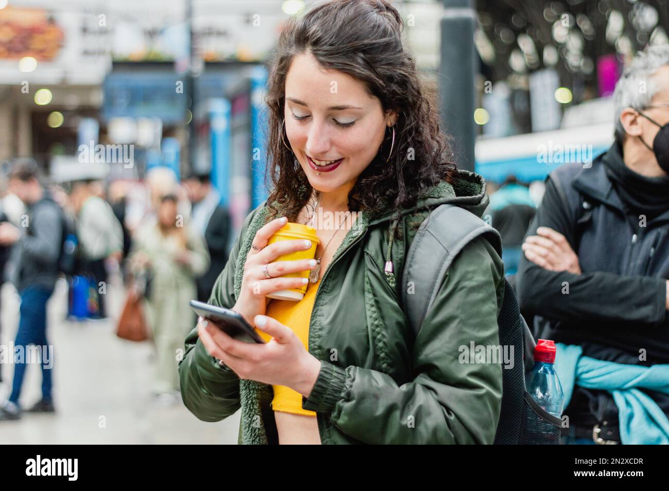 young latina woman of argentinian ethnicity, standing on the train ...