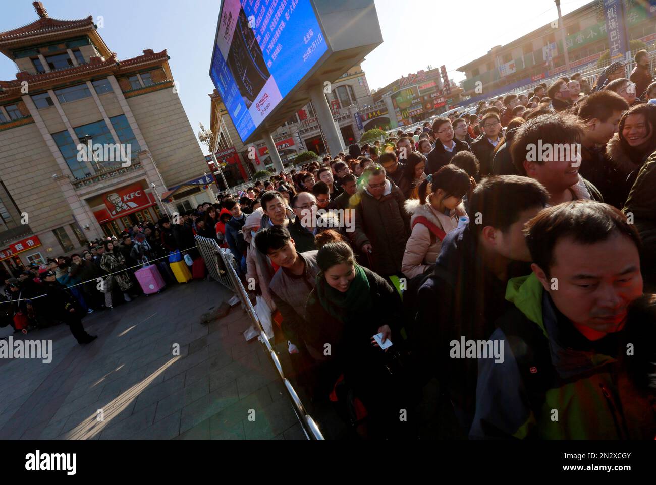 Passengers crowd at subway main entrance at the Beijing railway station ...