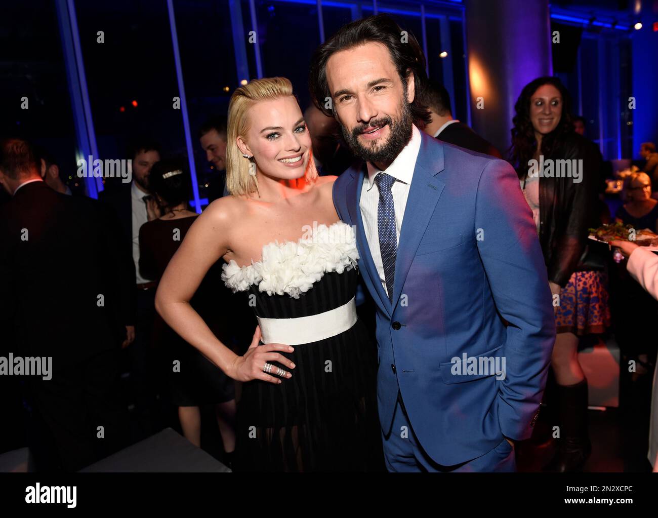 "Focus" cast members Margot Robbie, left, and Rodrigo Santoro pose ...
