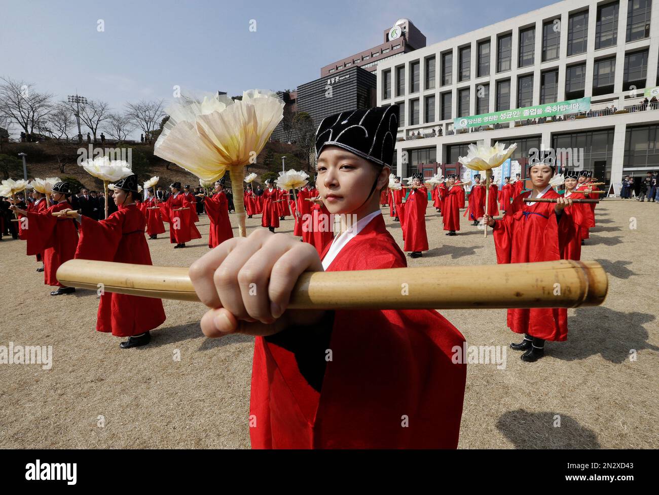 South Korean students wearing traditional Korean costumes perform ...