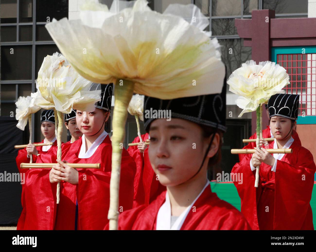 South Korean students wearing traditional Korean costumes perform ...