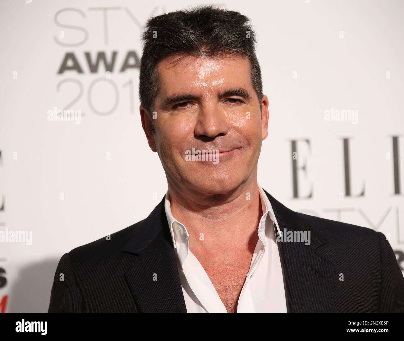 Simon Cowell poses for photographers at the Elle Style Awards in London ...