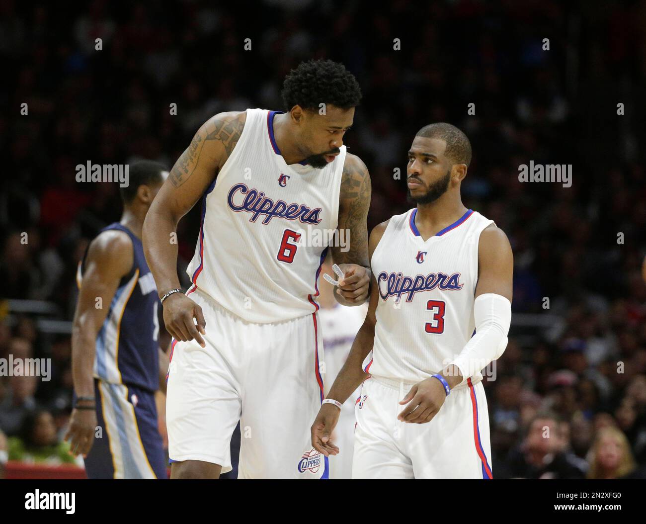 Los Angeles Clippers' DeAndre Jordan, left, talks to Chris Paul during ...