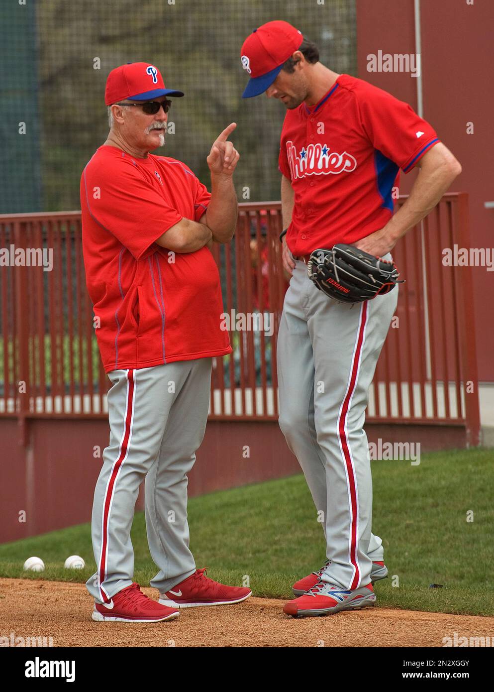 Philadelphia Phillies pitching coach Bob McClure, left, talks with Cole ...
