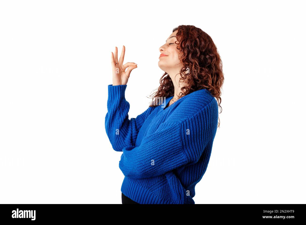 Side view of cute millennial woman wearing pullover sweater standing ...