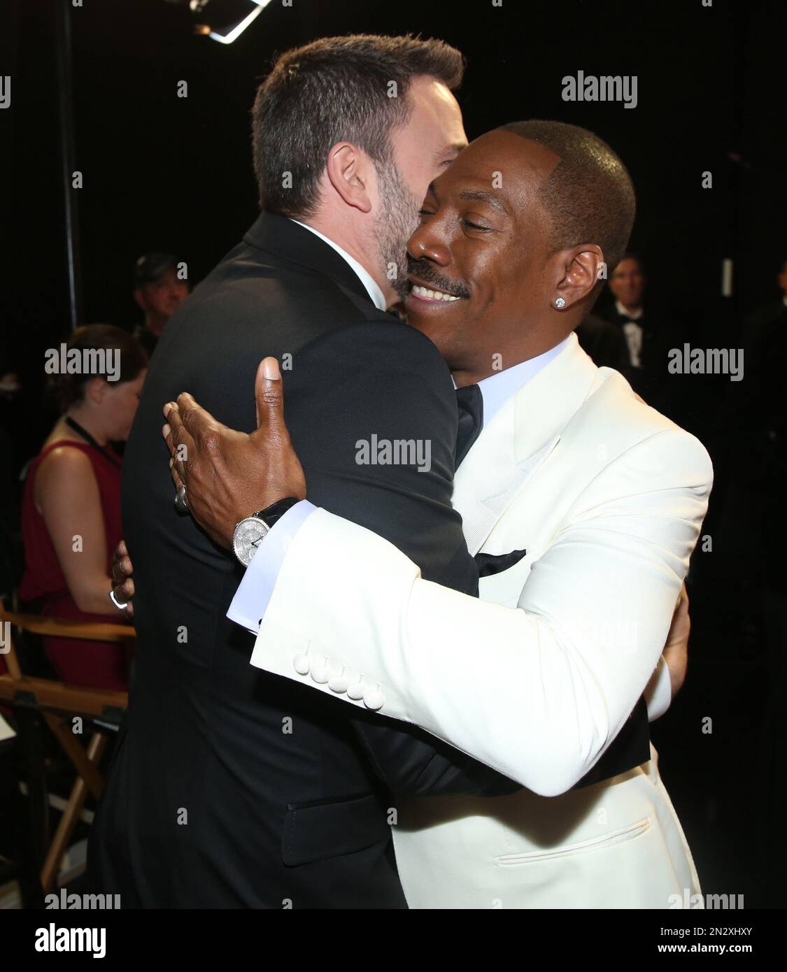 Ben Affleck, left, and Eddie Murphy embrace backstage at the Oscars on ...