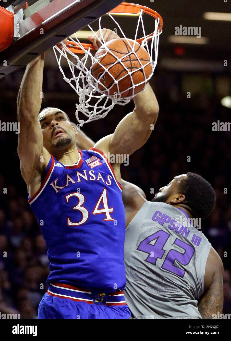 Kansas forward Perry Ellis (34) dunks after getting past Kansas State ...
