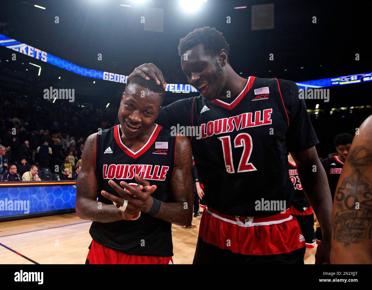 Louisville's Terry Rozier (0), left, and Mangok Mathiang (12) celebrate ...