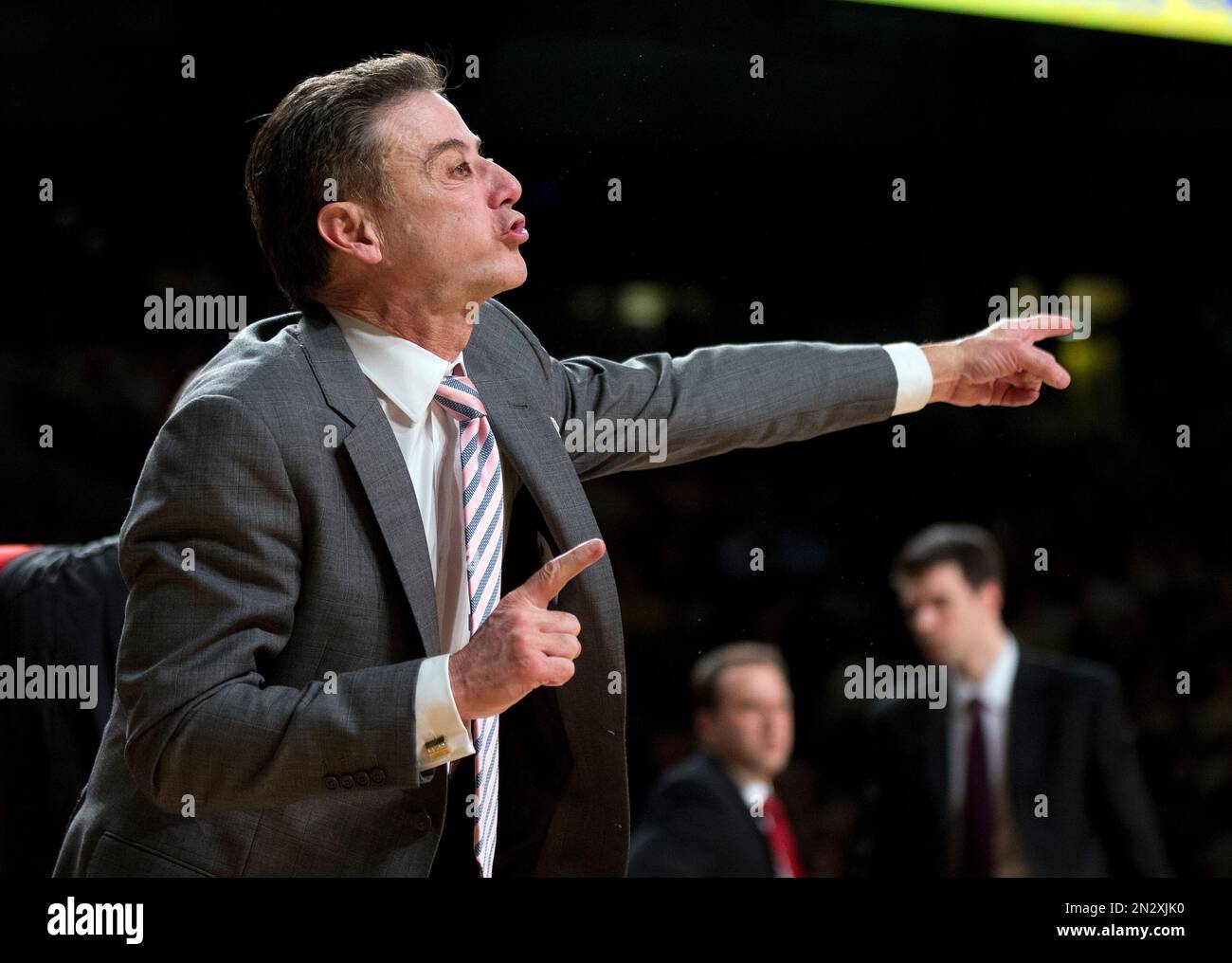 Louisville head coach Rick Pitino directs his tweak from the sideline ...