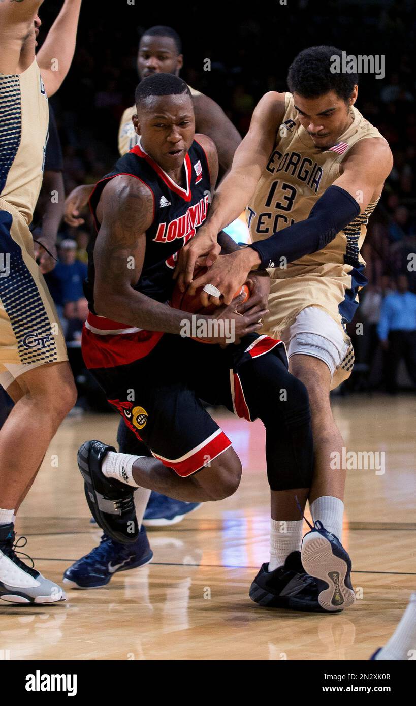 Louisville guard Terry Rozier (0) struggles with Georgia Tech forward ...
