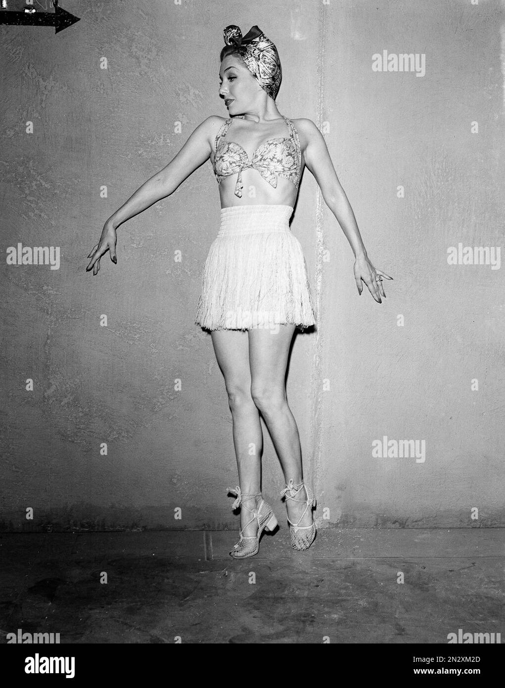 Mexican actress Lupe Velez models the Hawaiian costume which she wears ...