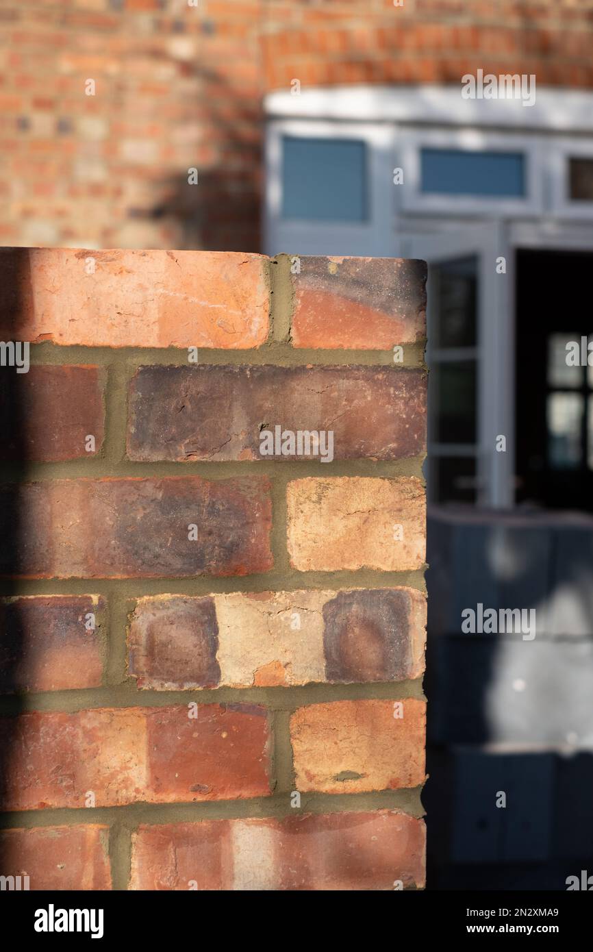 Newly built brick wall with fresh mortar, part of a renovation of an ...