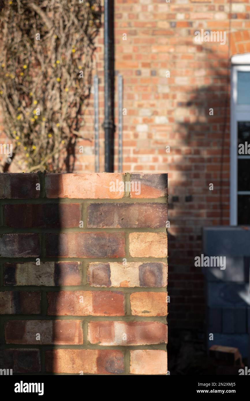 Newly built brick wall with fresh mortar, part of a renovation of an ...
