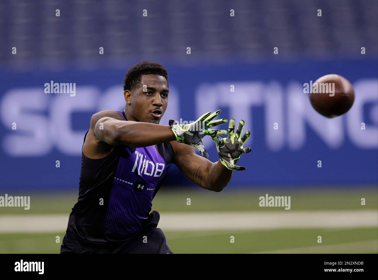 Texas defensive back Quandre Diggs runs a drill at the NFL football ...