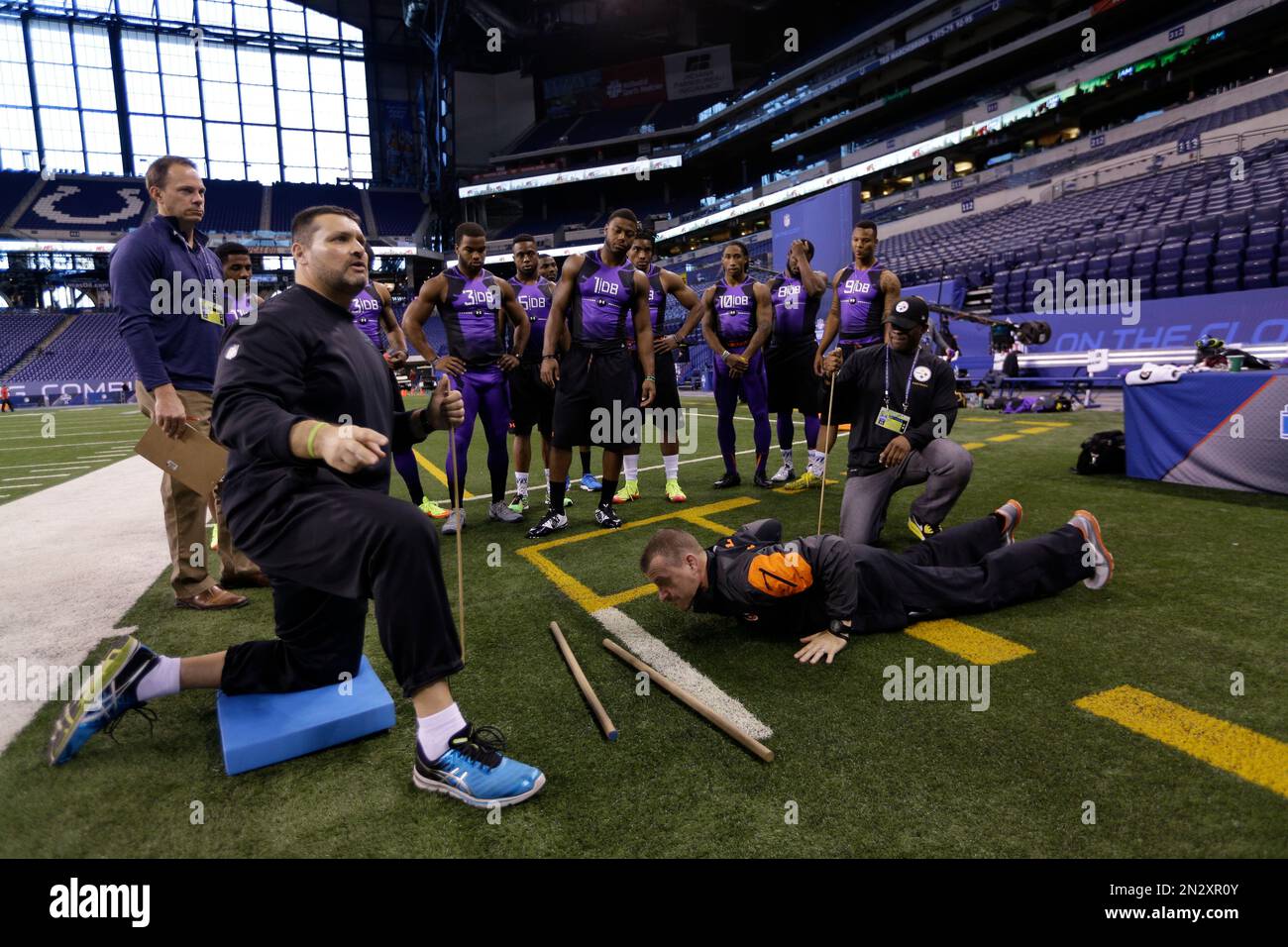 Defensive backs are shown a flexibility test at the NFL football ...