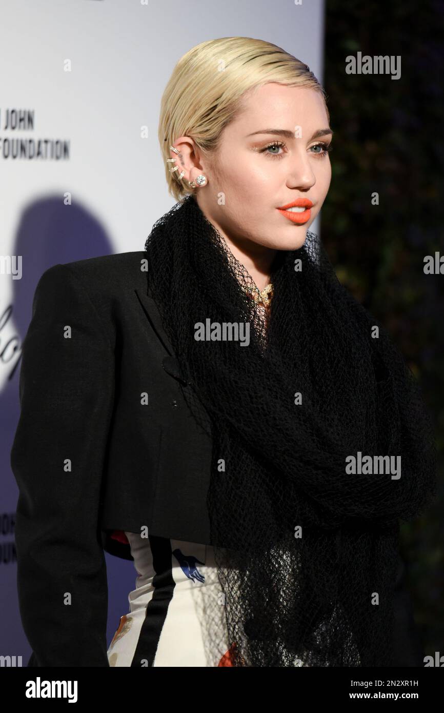 Miley Cyrus arrives at the 87th Academy Awards - 2015 Elton John AIDS ...