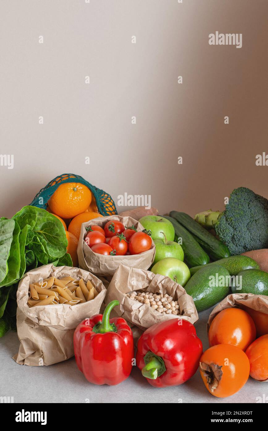 zero waste packaging. Different vegetables and fruits in paper bags on ...