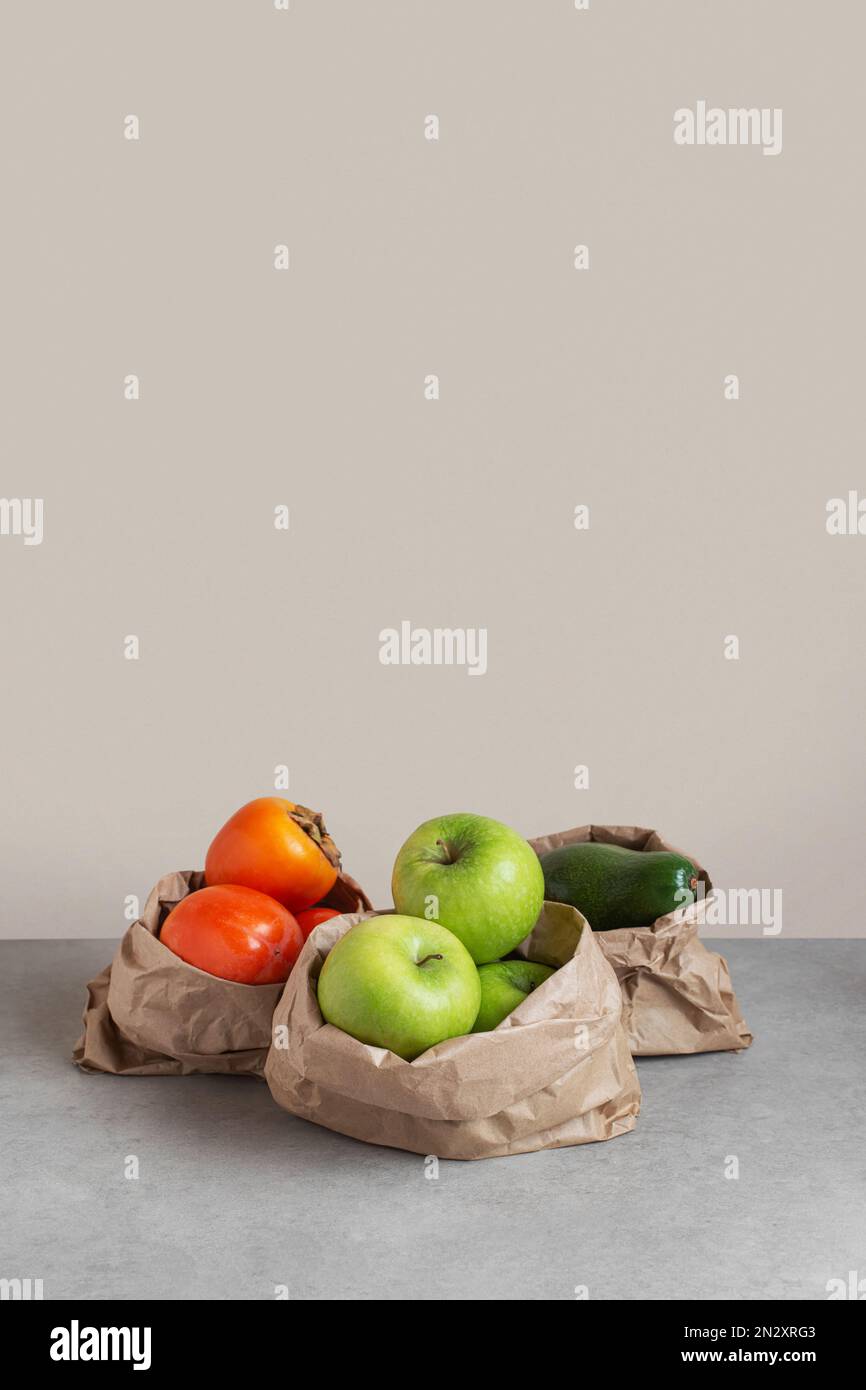 zero waste packaging. Different vegetables and fruits in paper bags on ...