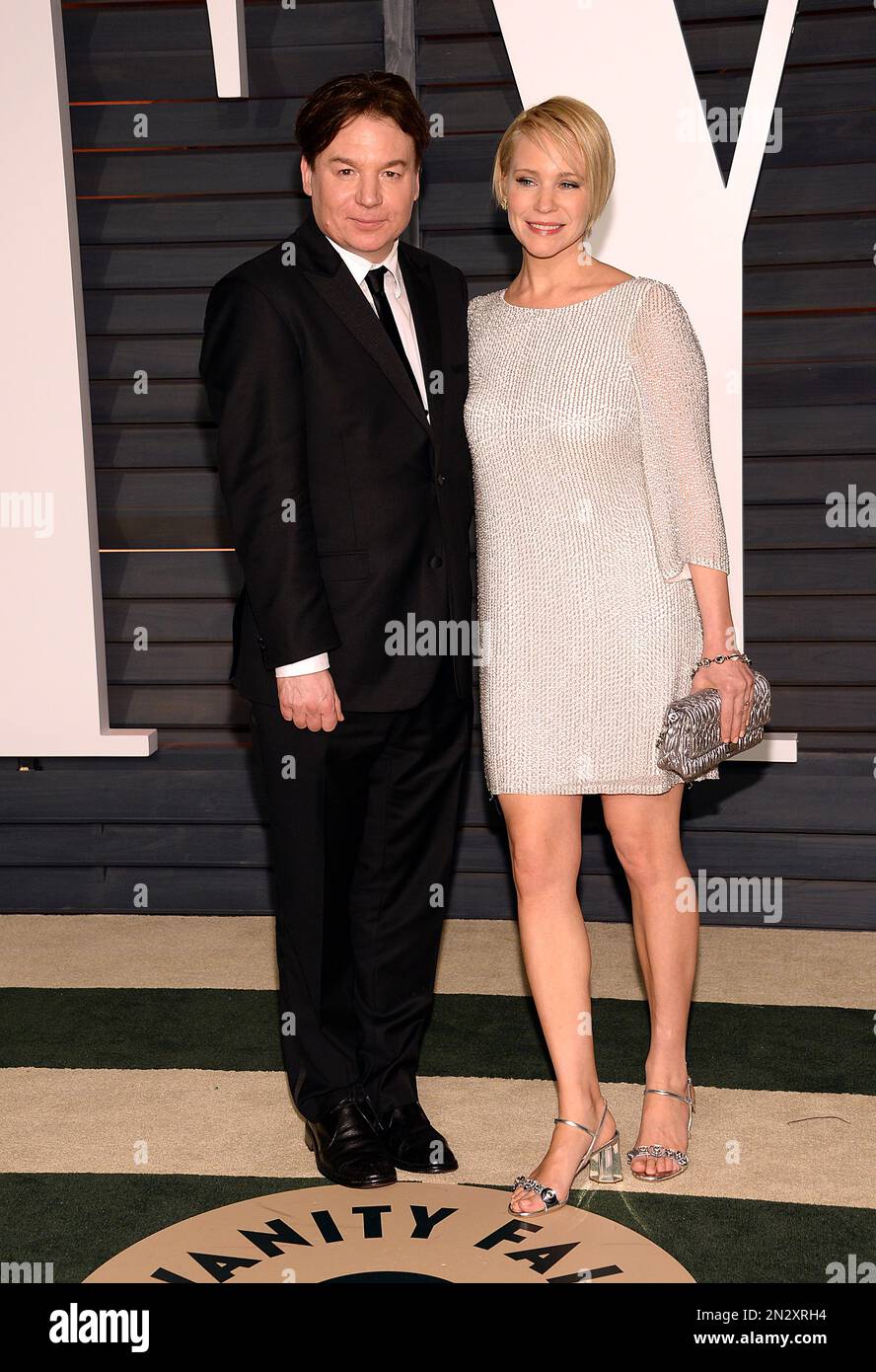 Actor Mike Myers, left, and Kelly Tisdale arrive at the 2015 Vanity ...