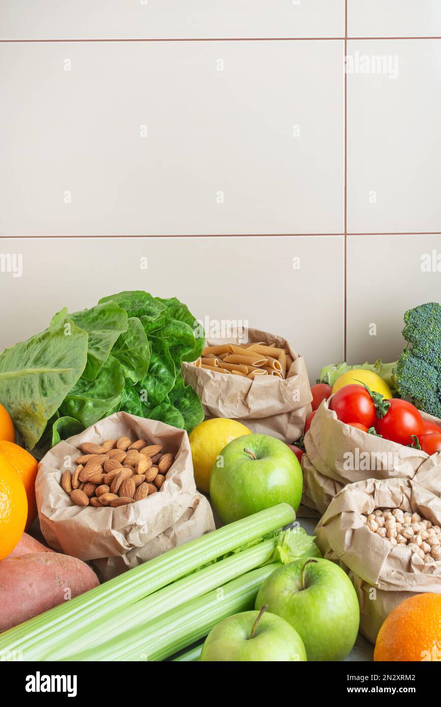 zero waste packaging. Different vegetables and fruits in paper bags on ...