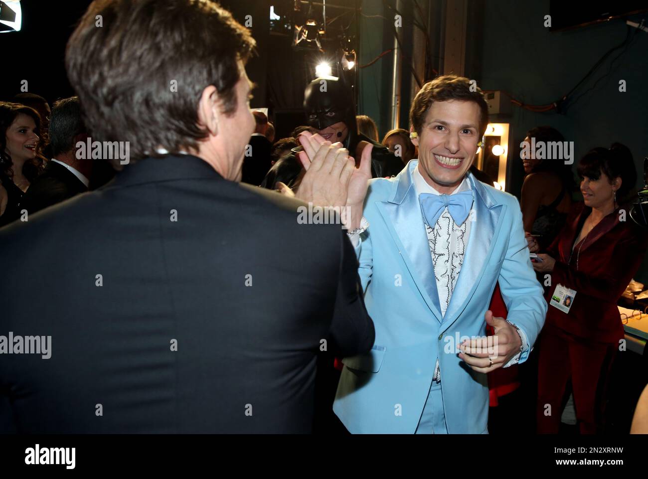 Jason Bateman, left, and Andy Samberg high five backstage at the Oscars ...
