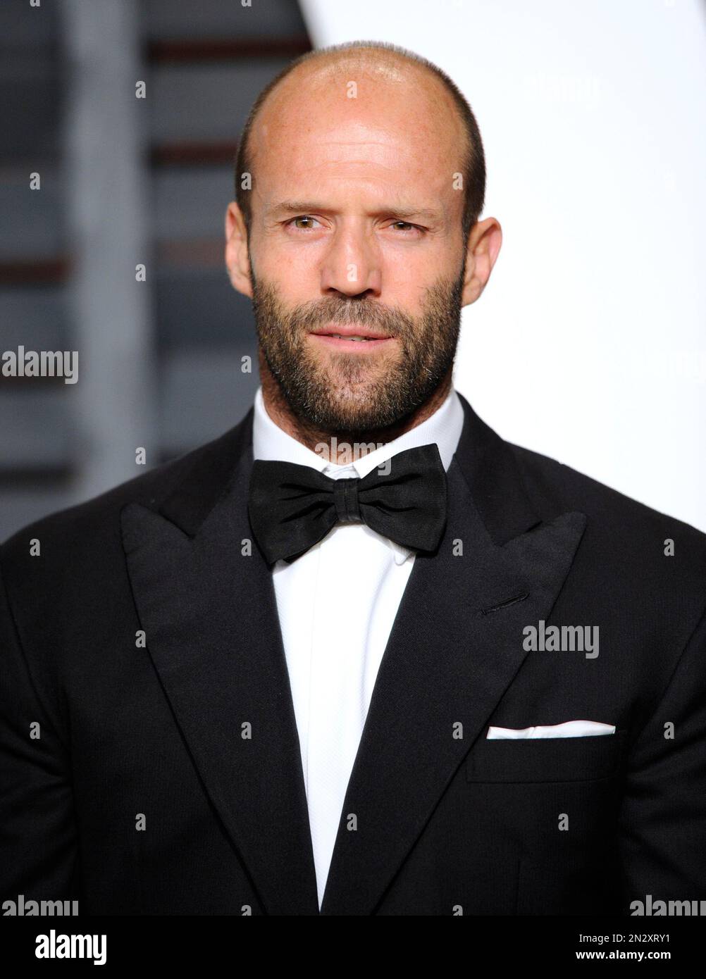 Jason Statham arrives at the 2015 Vanity Fair Oscar Party on Sunday ...