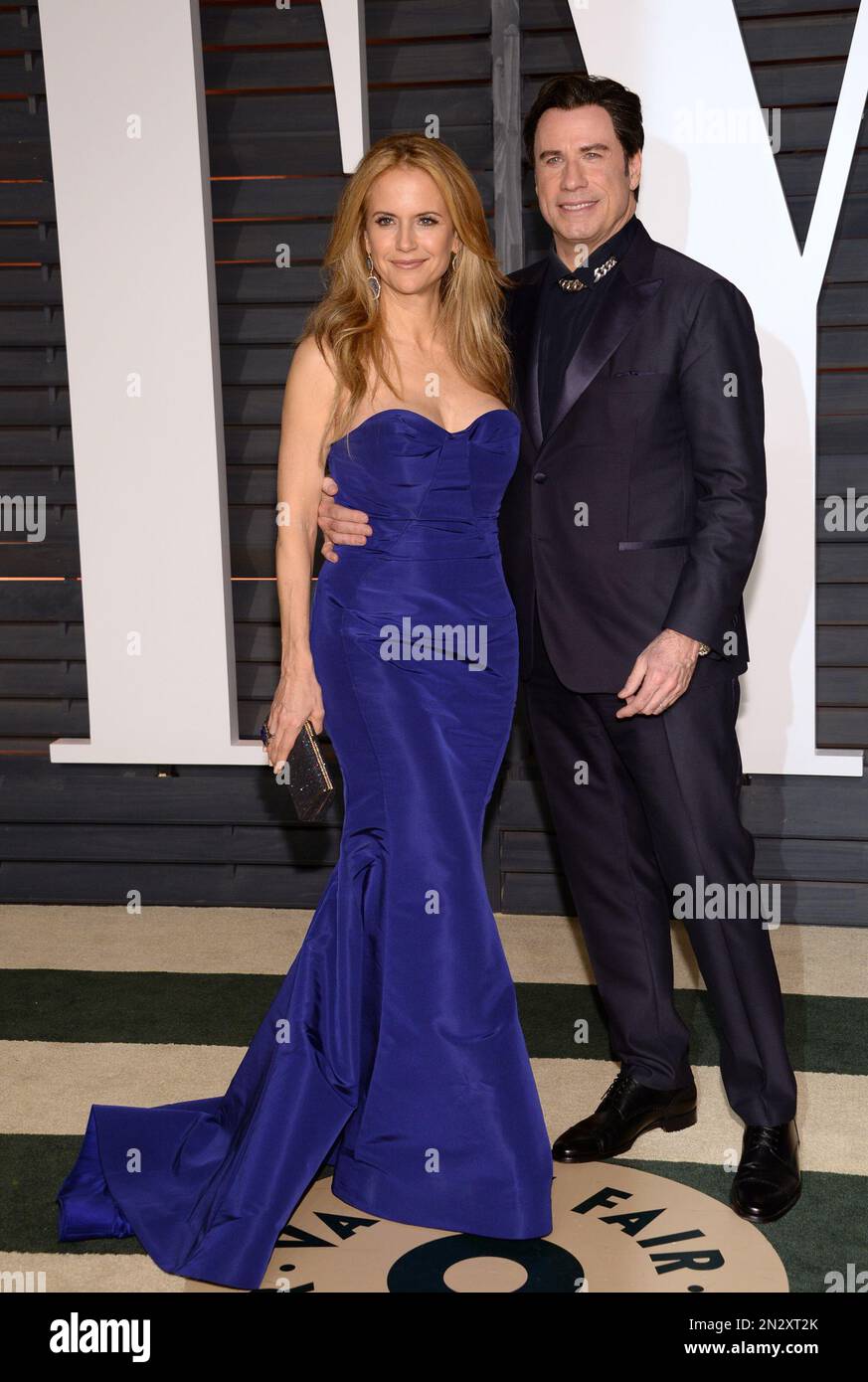 Kelly Preston, left, and John Travolta arrive at the 2015 Vanity Fair ...
