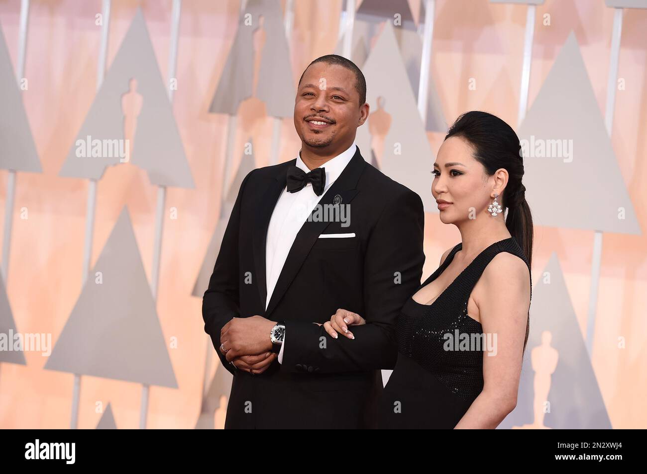 Terrence Howard, left, and Miranda Howard arrive at the Oscars on ...