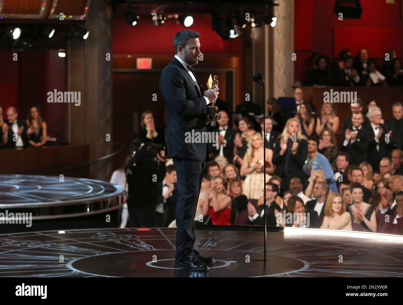 Ben Affleck appears on stage as he presents the award for best director ...